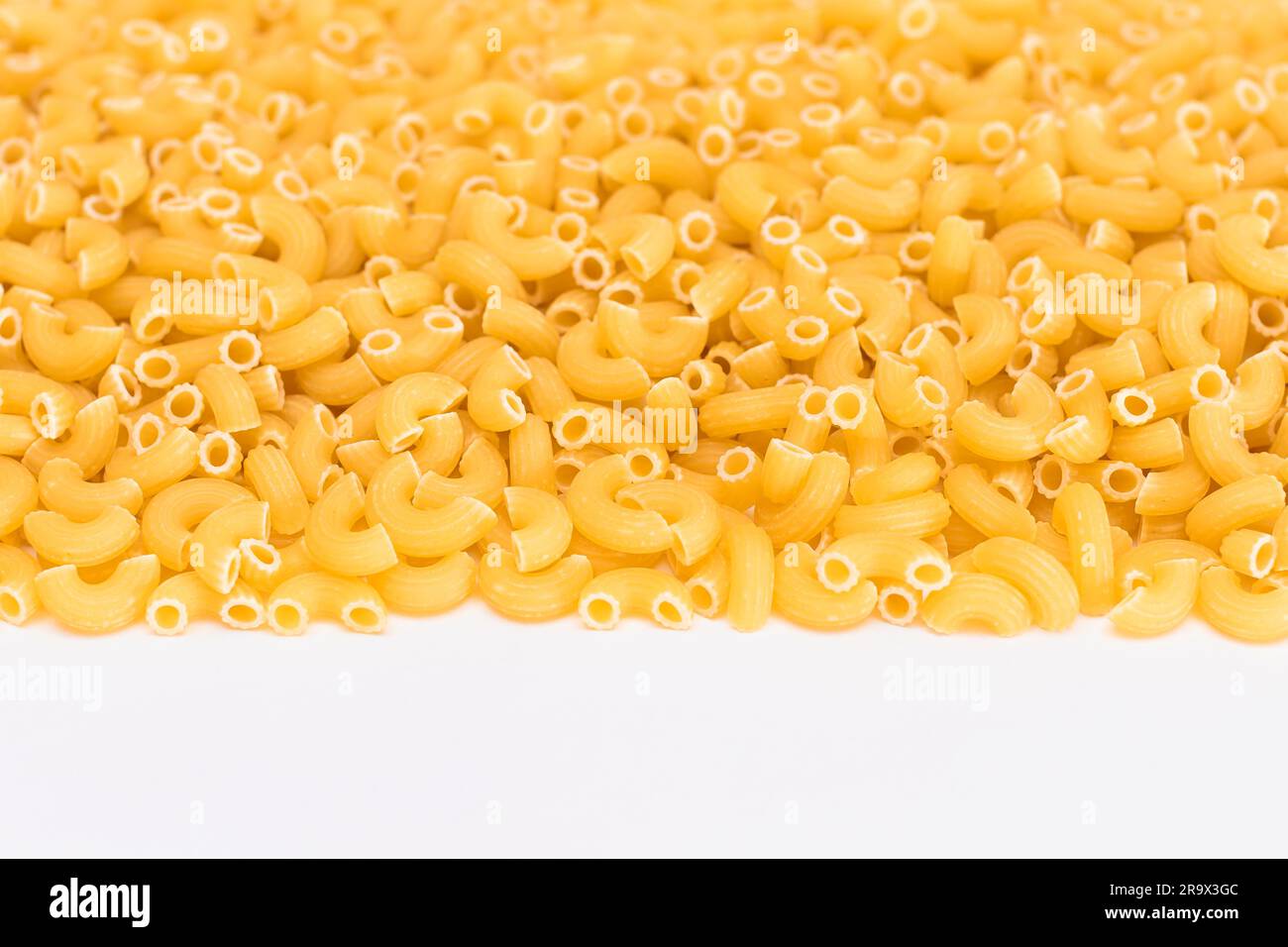 Uncooked Chifferi Rigati Pasta Scattered on White Table. Fat and ...