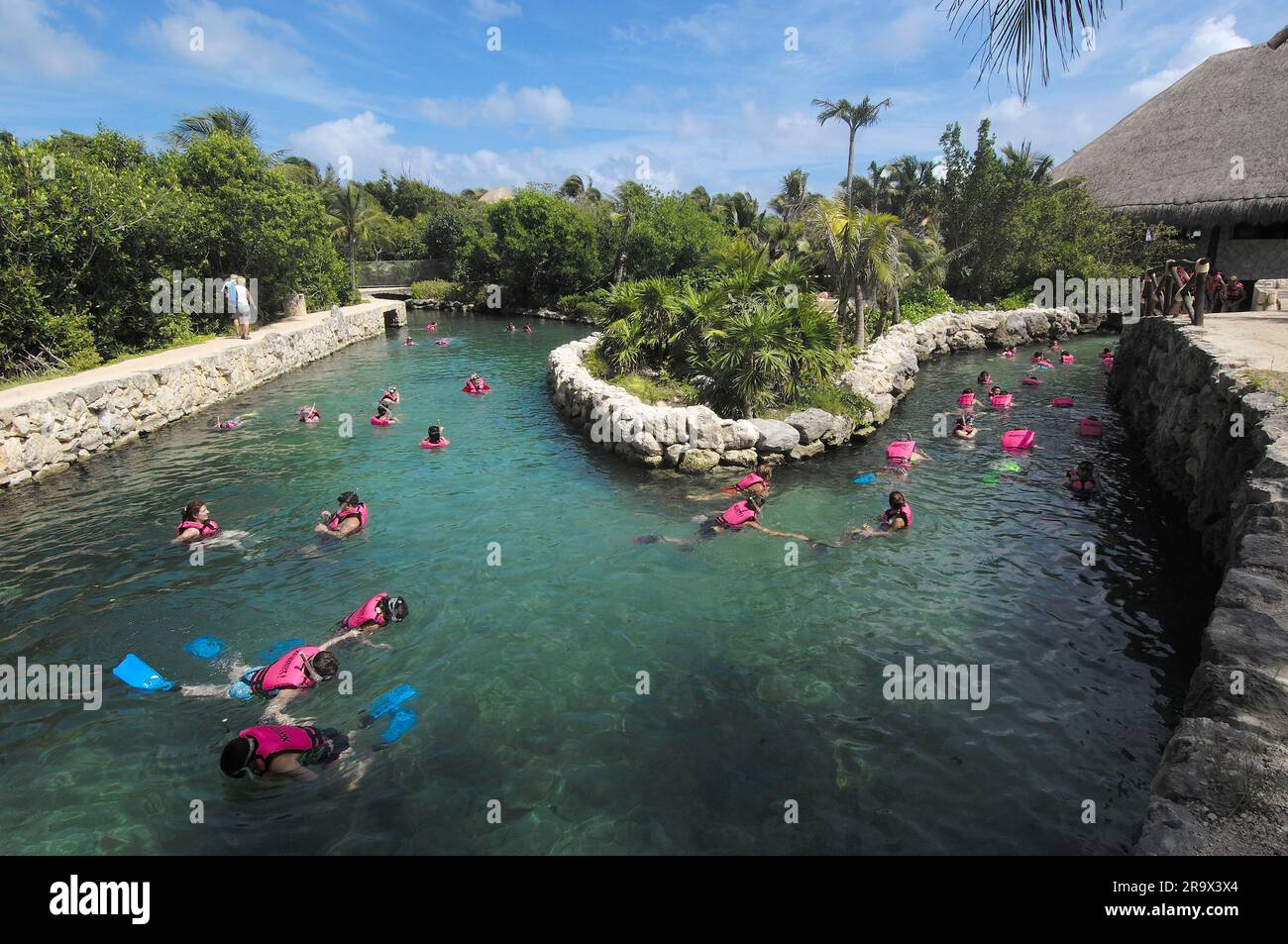 Visitors in the underground river, Xcaret Ecological Park, near Playa ...