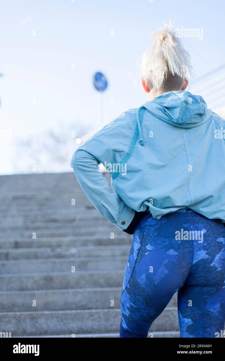 Slim blonde female rear view hi-res stock photography and images - Alamy