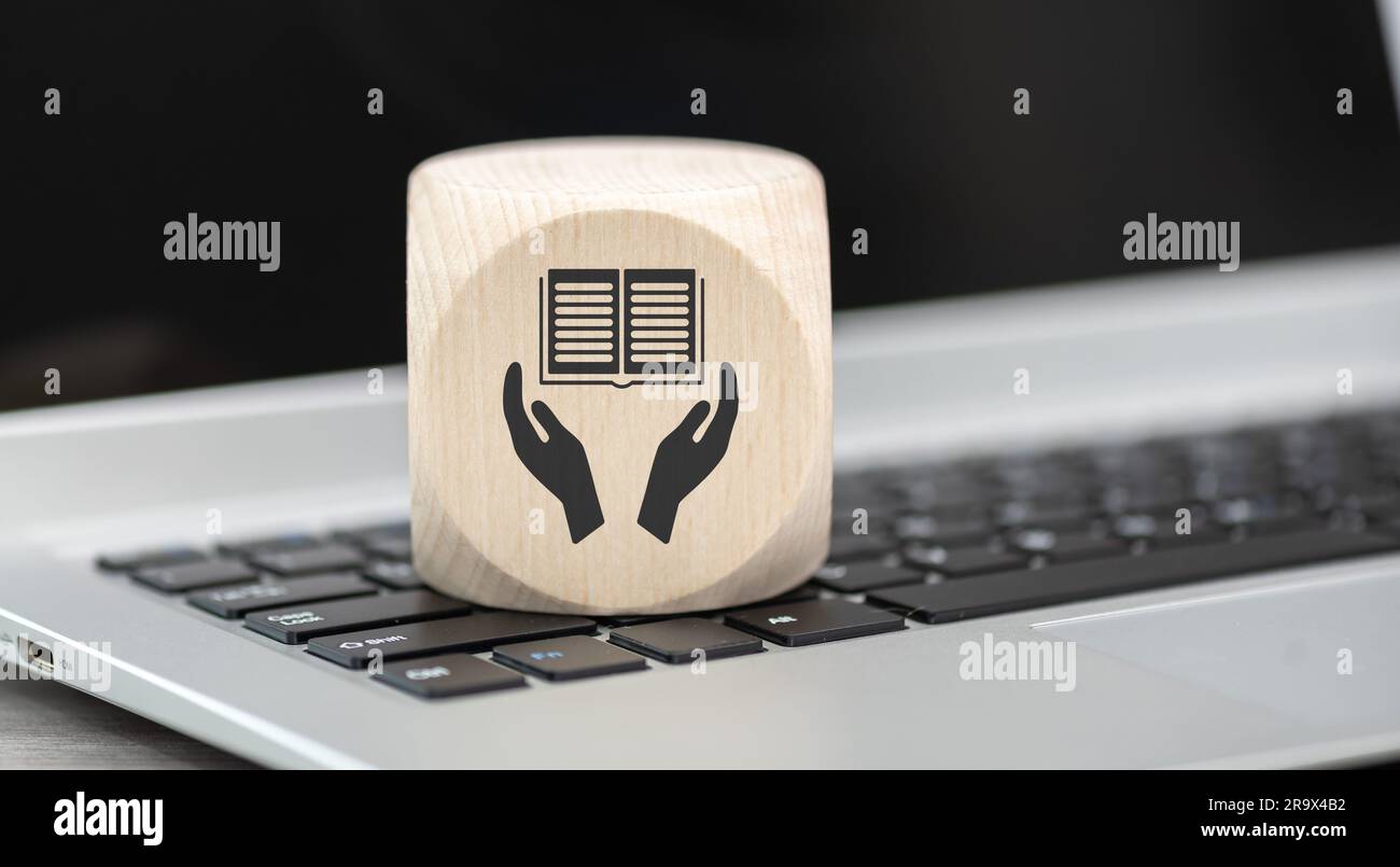 Wooden block with symbol of knowledge concept on laptop keyboard Stock ...