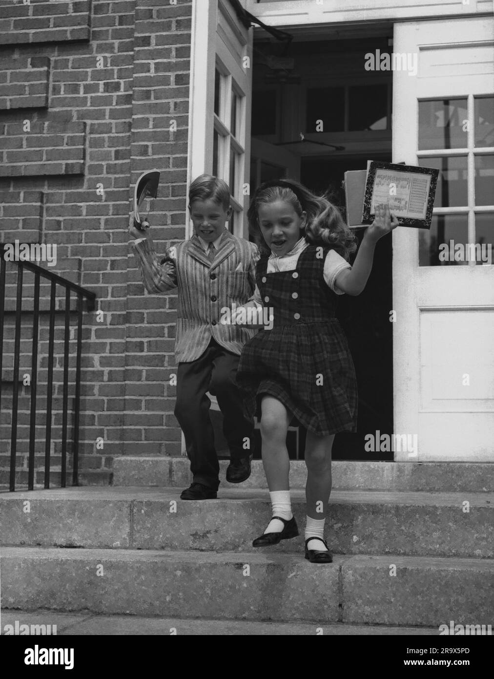 Boy running up stairs Black and White Stock Photos & Images - Alamy