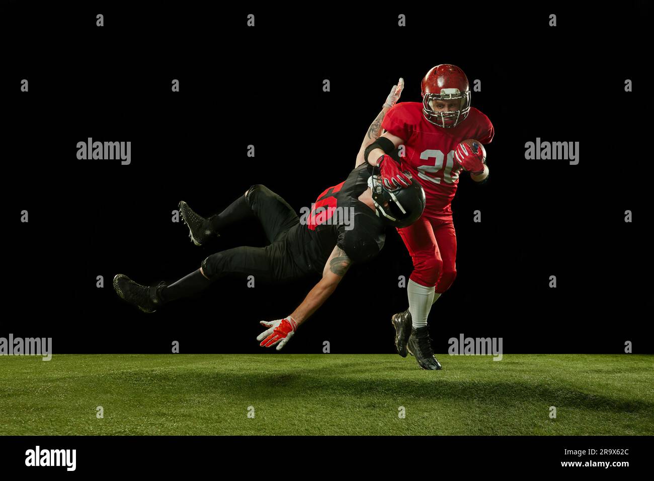 Two competitive men, american football players in full uniform and ...