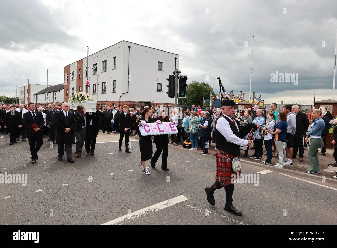 Chloe Mitchell's sisters Kirsty (left) and Nadine carry a wreath in ...