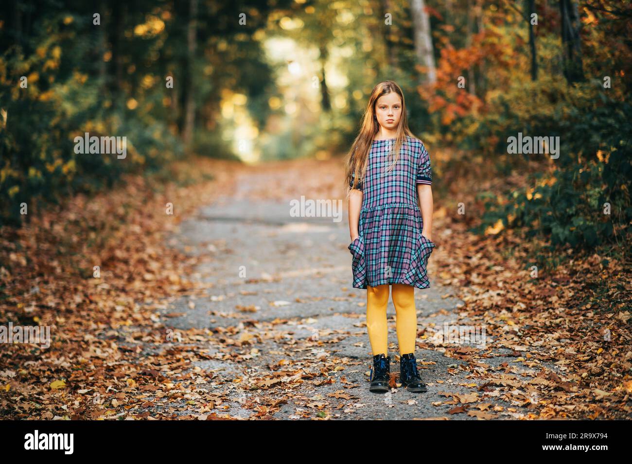Autumn portrait of pretty young girl, kid model posing outdoor in ...
