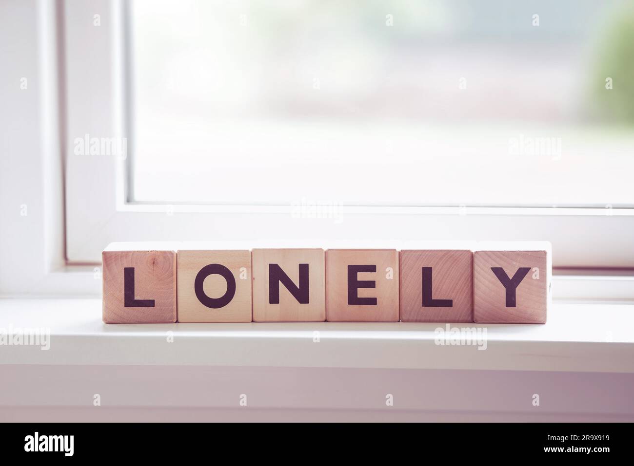 Lonely sign in a bright window at daytime Stock Photo - Alamy