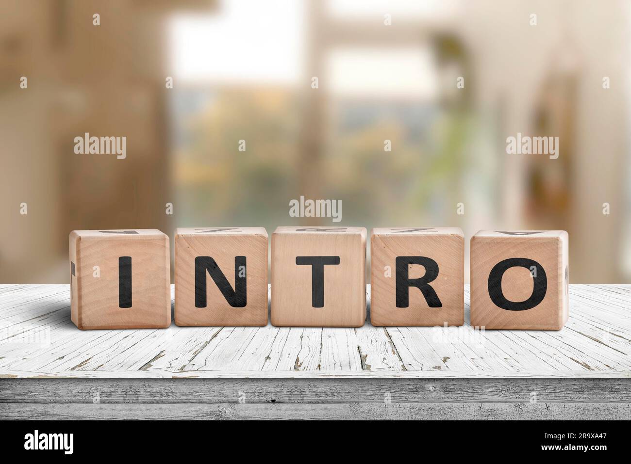 Intro sign made with wooden cubes in a bright room on a table Stock ...