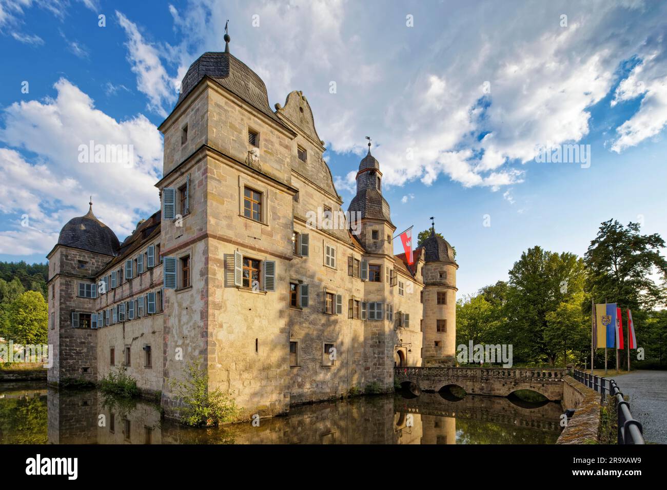North-west side of Mitwitz moated castle with moat, stone bridge and ...