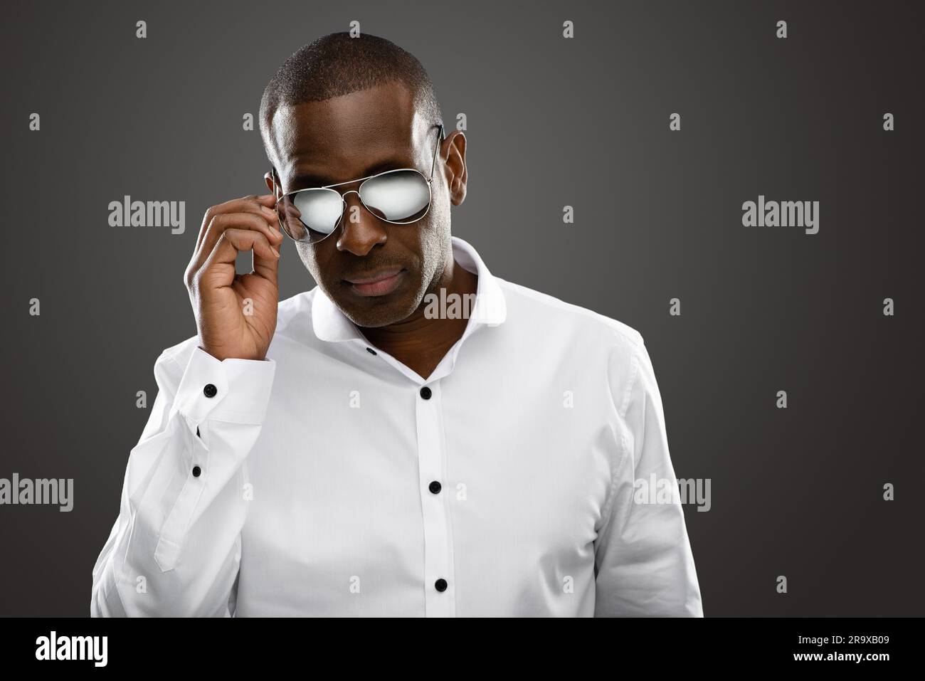 Confidence, portrait of a black man with sunglasses and against a ...