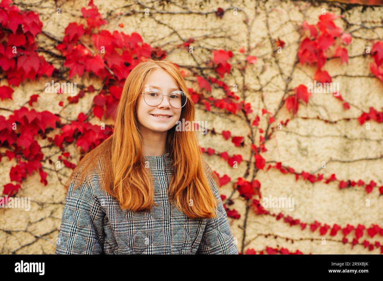 Autumn portrait of adorable red-haired preteen girl girl check jacket ...