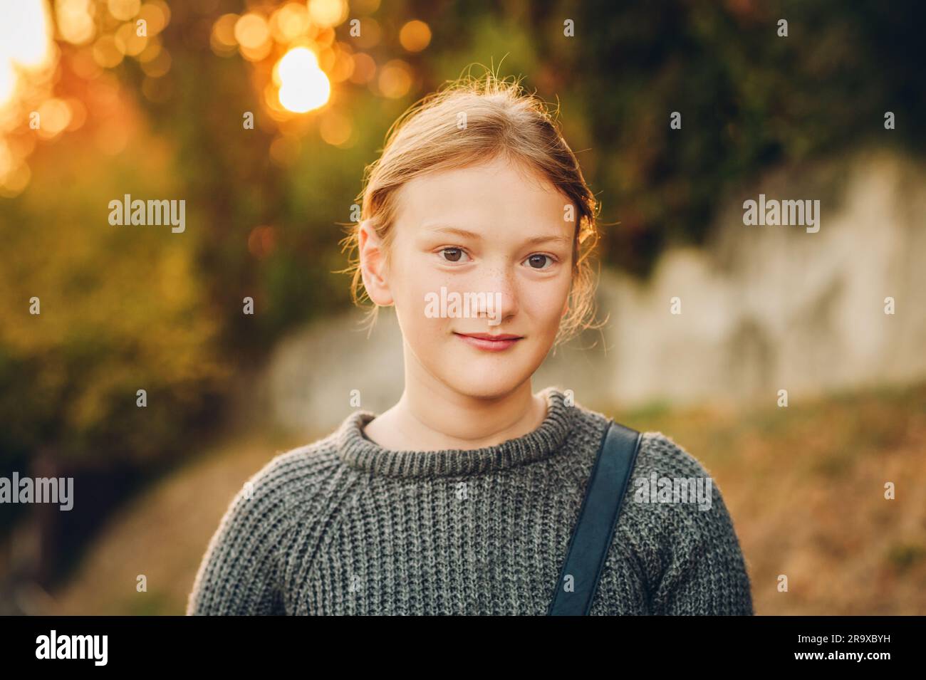 Outdoor close up portrait of young 10-11 year old girl in sunlight ... Outdoor close up portrait of young 10-11 year old girl in sunlight ...