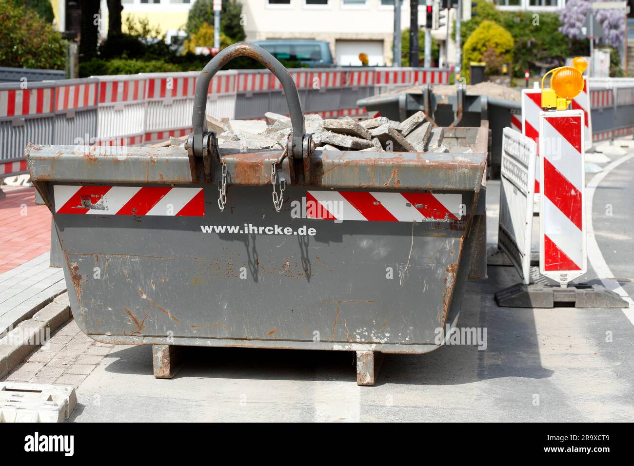 Container, skip for construction waste standing on the road ...