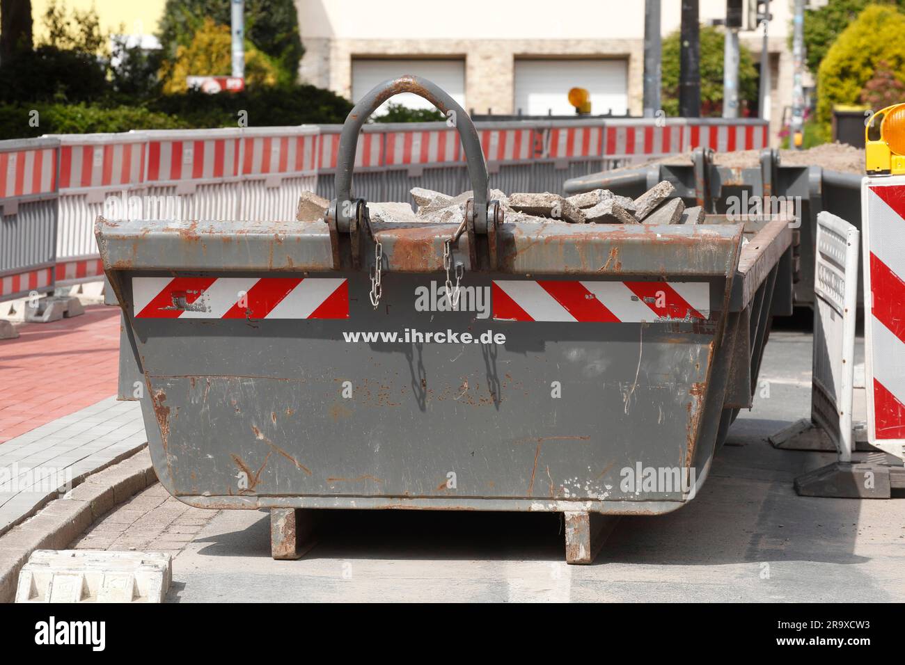 Container, skip for construction waste standing on the road ...