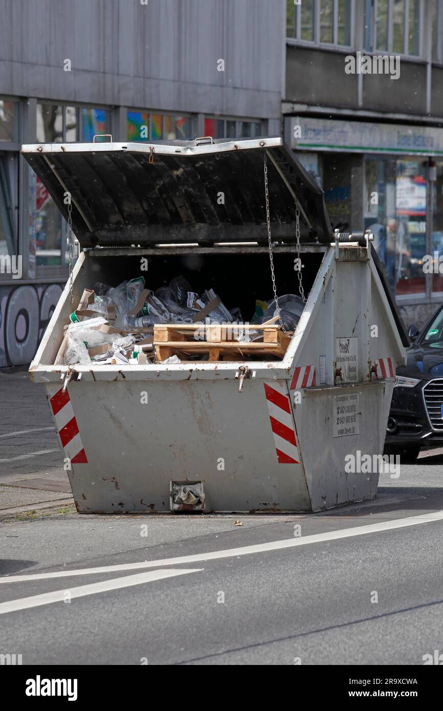 Container, skip for building rubble and bulky waste standing on the ...