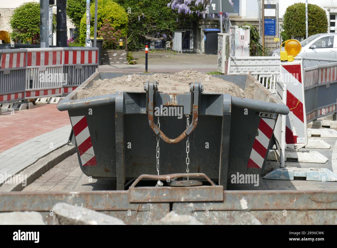 Container, skip for construction waste standing on the road ...