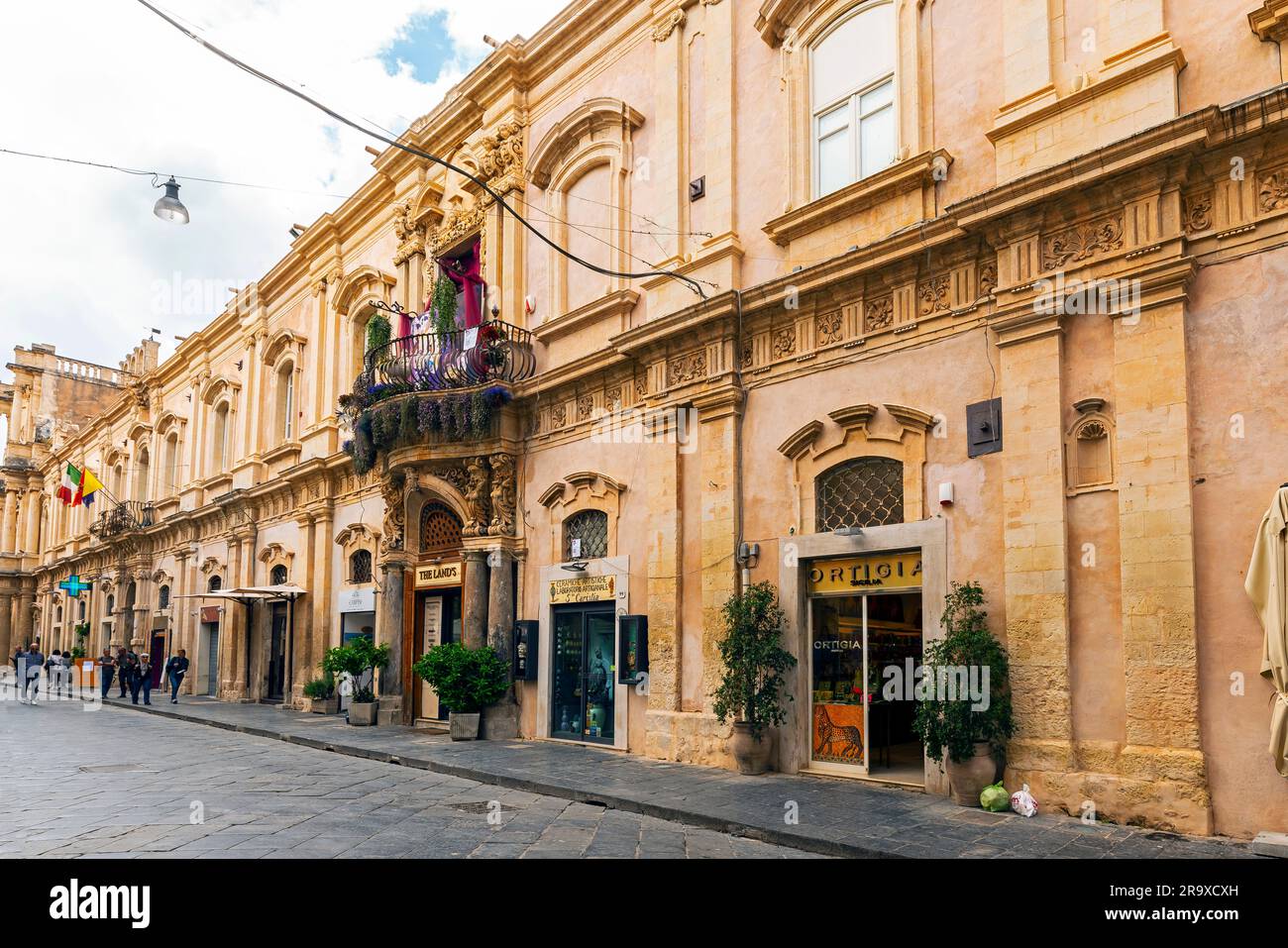 Street view of former Jesuit College with its large four columnsportal ...