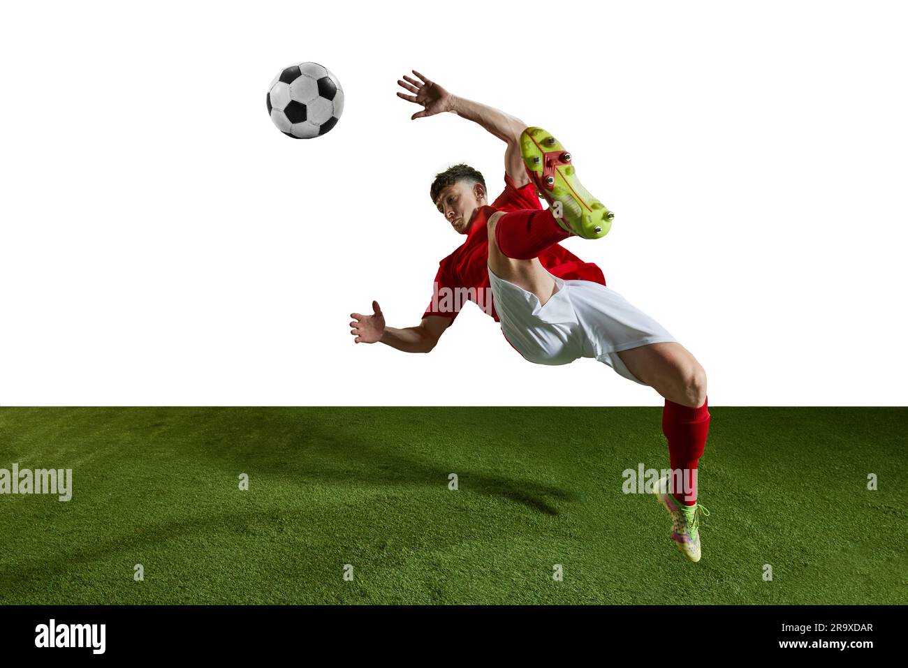 Champion. Young man, professional football player in motion, kicking ...