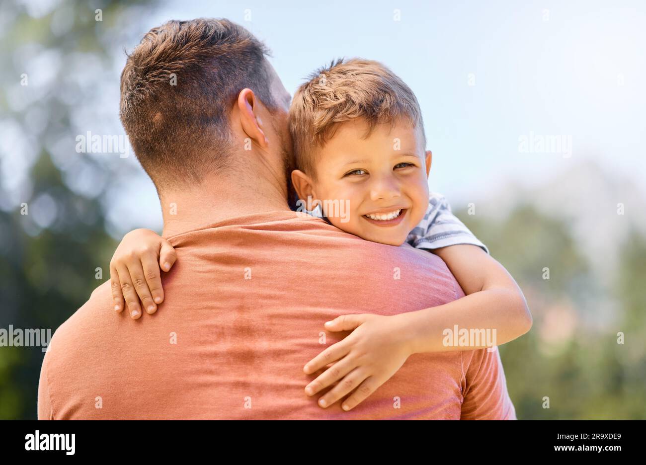 Portrait, father and son hug, outdoor and smile with quality time ...