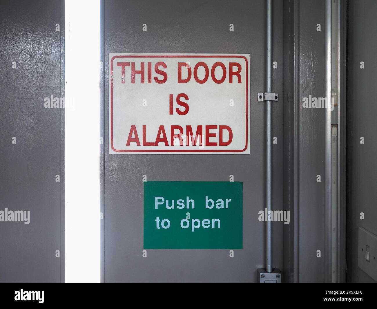 this door is alarmed push bar to open emergency exit sign Stock Photo ...