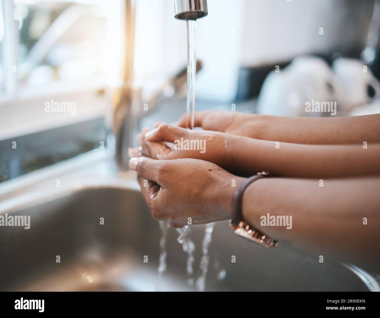 Washing hands, kitchen and parent with a child in their home for ...