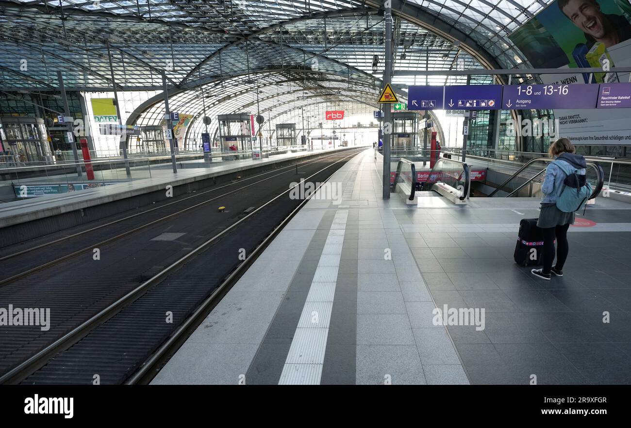 FILE - A person stands on the empty station platform at the main ...