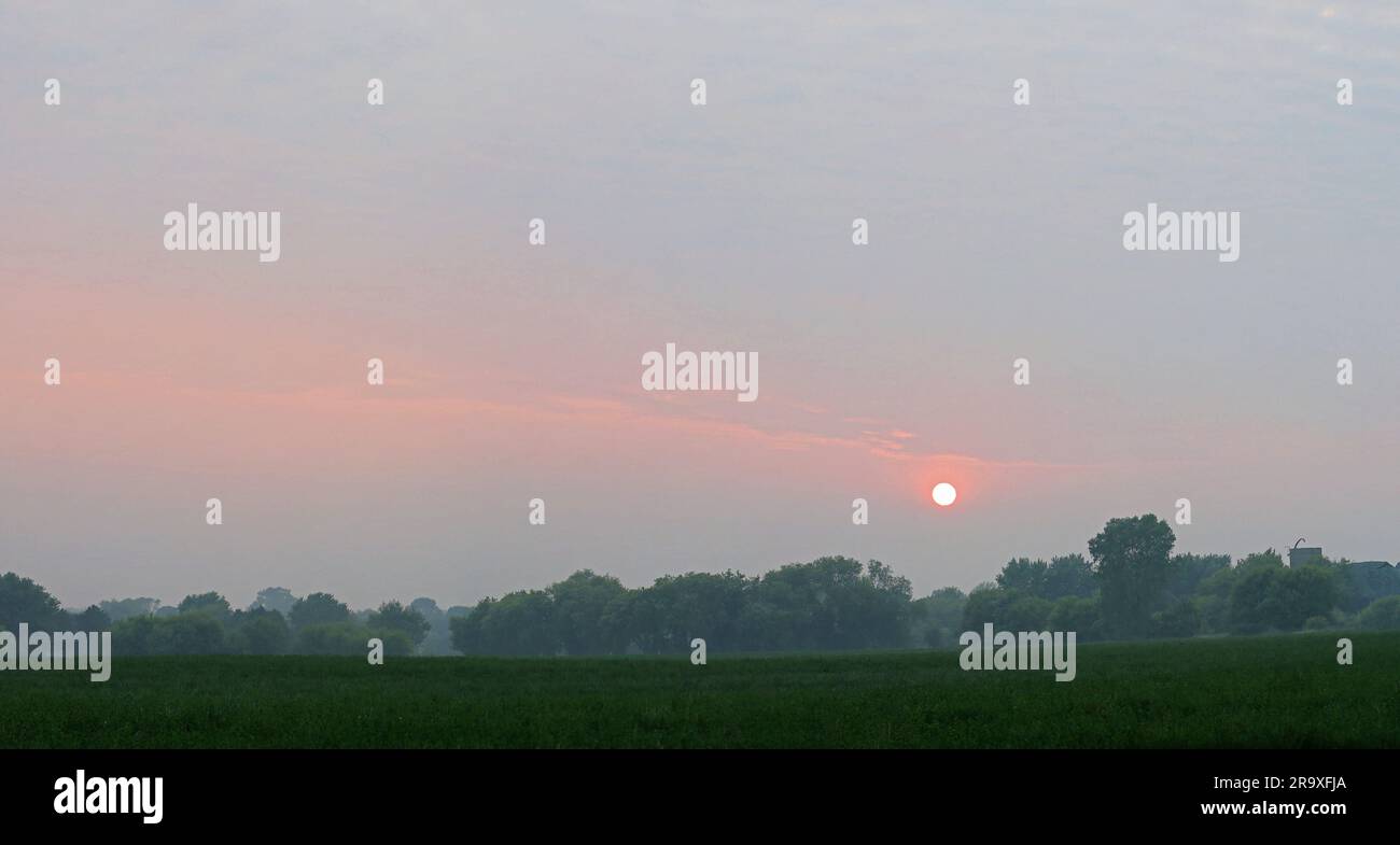 Wildfire smoke from fires burning in Canada, creates haze and clogs the ...