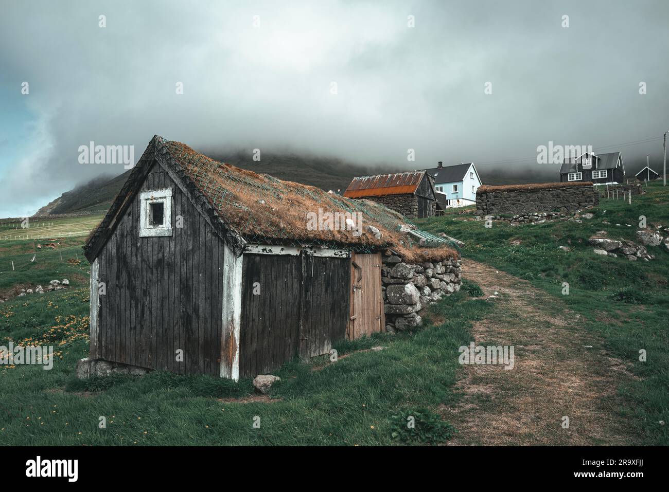 A stunning aerial landscape of the Faroe Islands featuring lush green ...