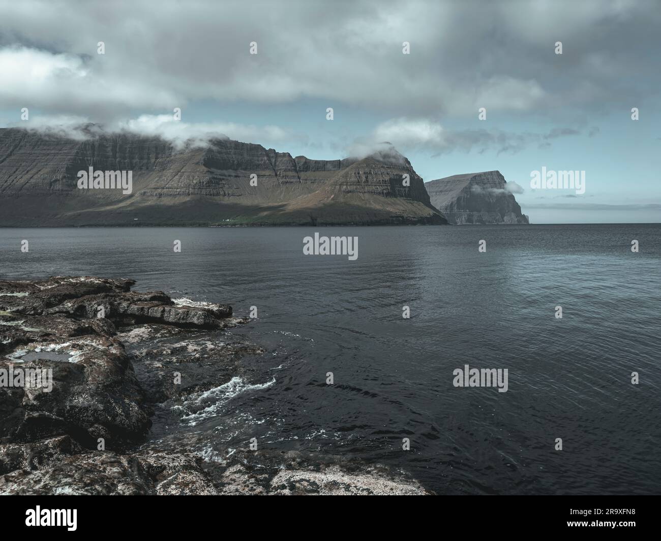 A stunning aerial landscape of the Faroe Islands featuring lush green ...