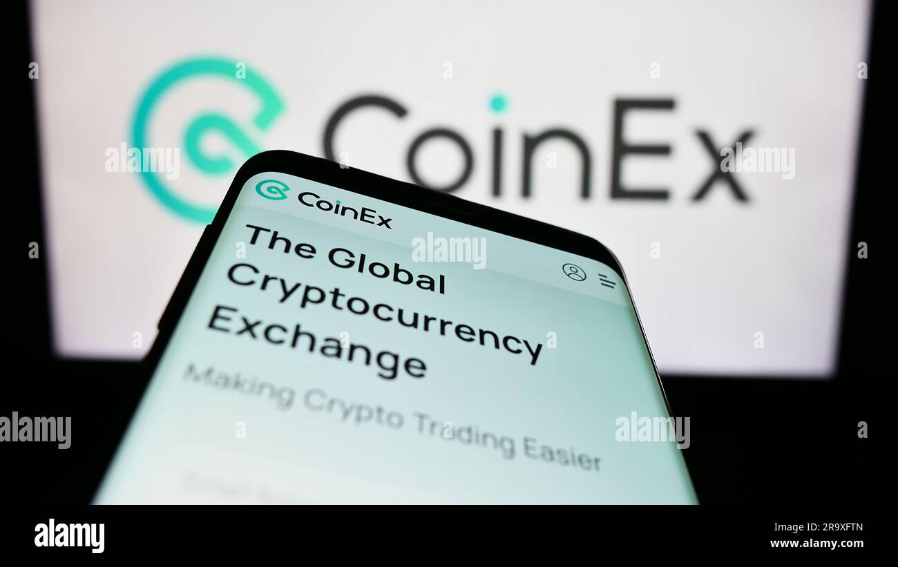 Mobile phone with website of crypto currency exchange company CoinEx on ...