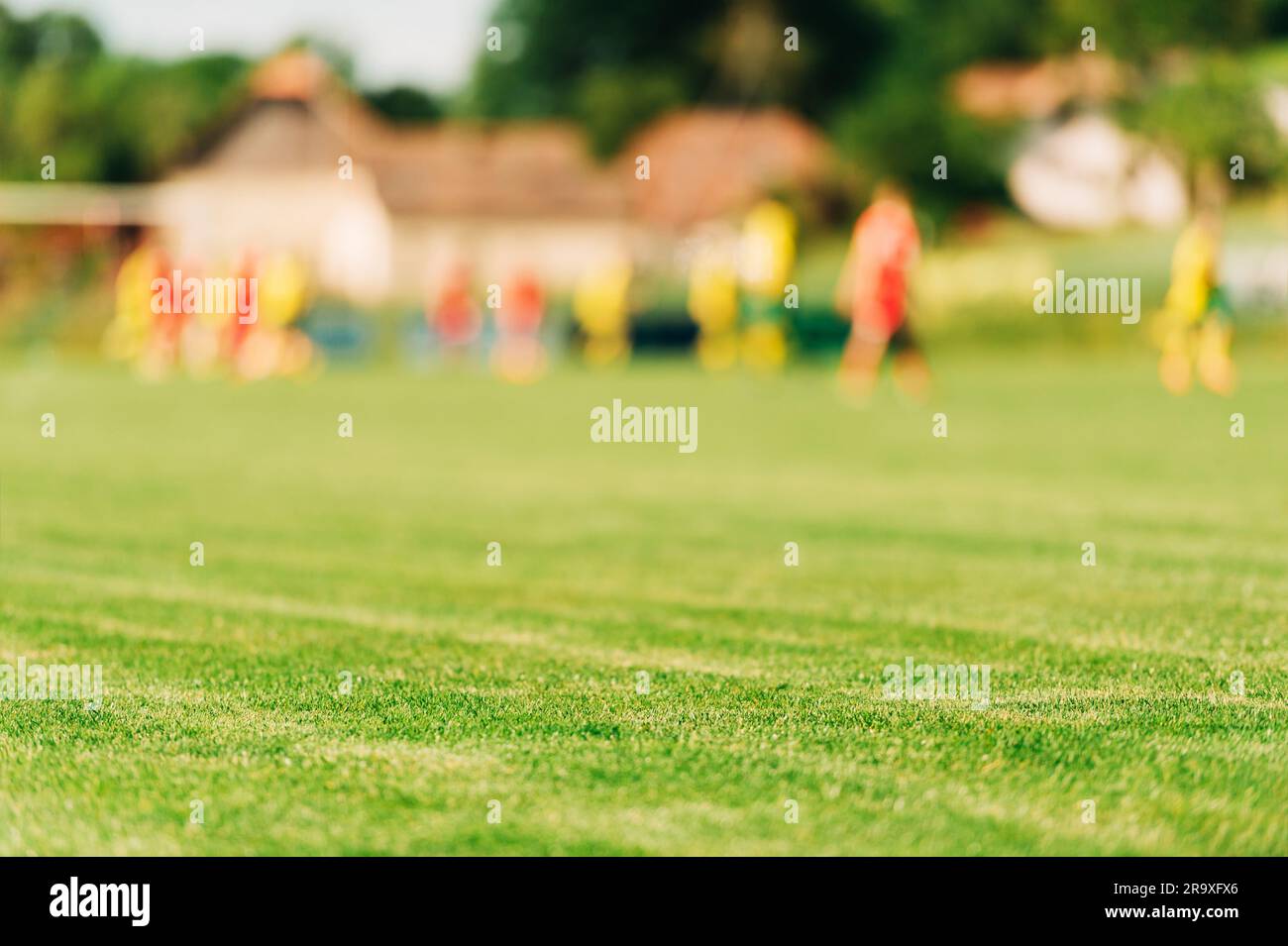 Blurred background with soccer players training Stock Photo - Alamy