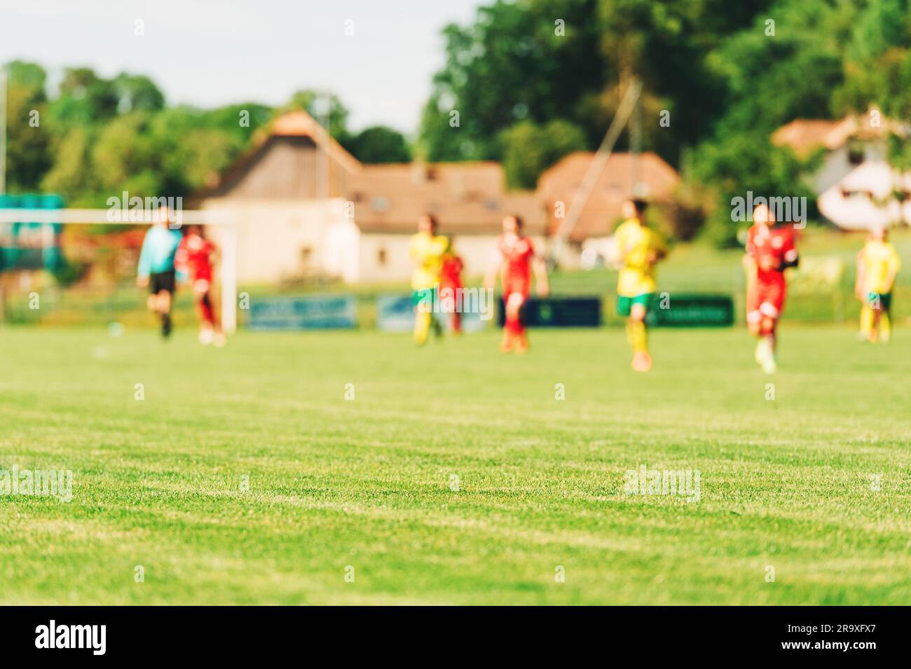 Blurred background with soccer players training Stock Photo - Alamy