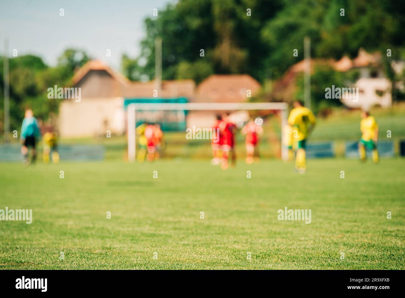 Blurred background with soccer players training Stock Photo - Alamy