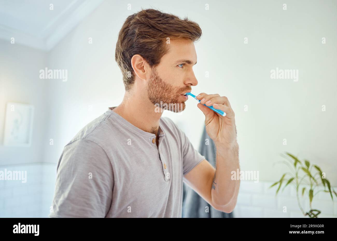 Man, bathroom and brushing teeth for dental hygiene, health and oral ...