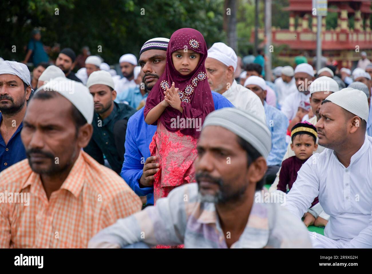 Kolkata, India. 29th June, 2023. A little girl joins the prayer while ...