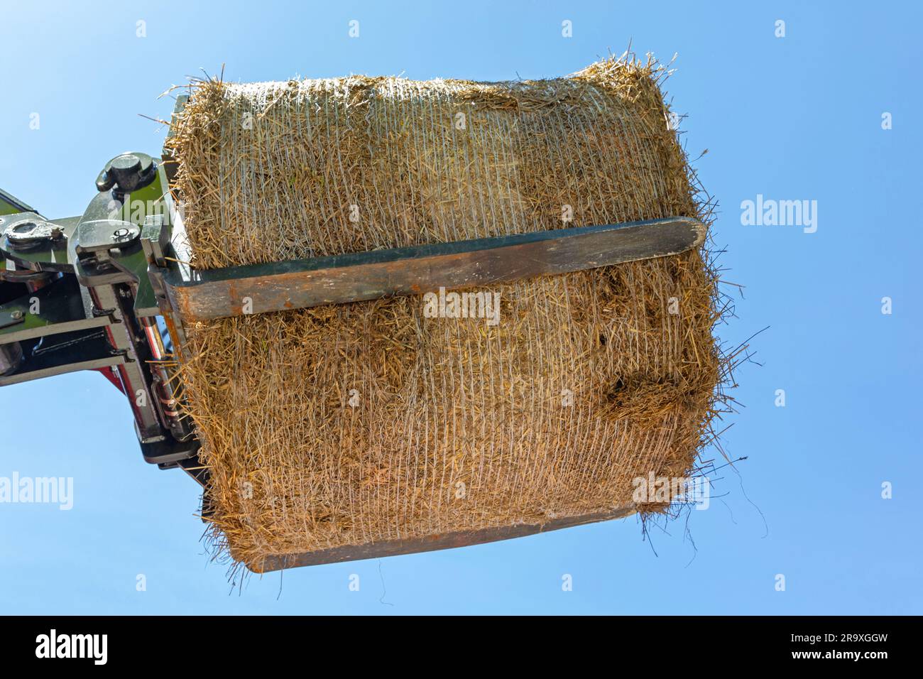 Hay Bale Pick With Forks Forklift Truck Farm Equipment Stock Photo - Alamy