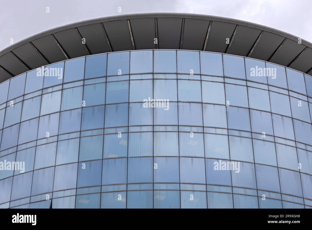 Round Office Building With Blue Glass Facade Windows Stock Photo - Alamy
