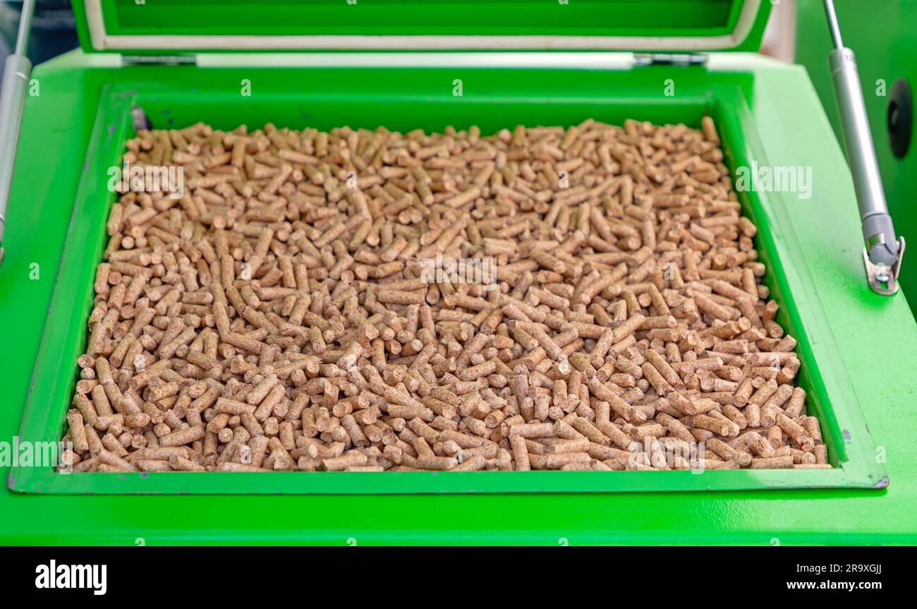 Wood Pellets Fuel in Top Loading Burner Stove Stock Photo - Alamy