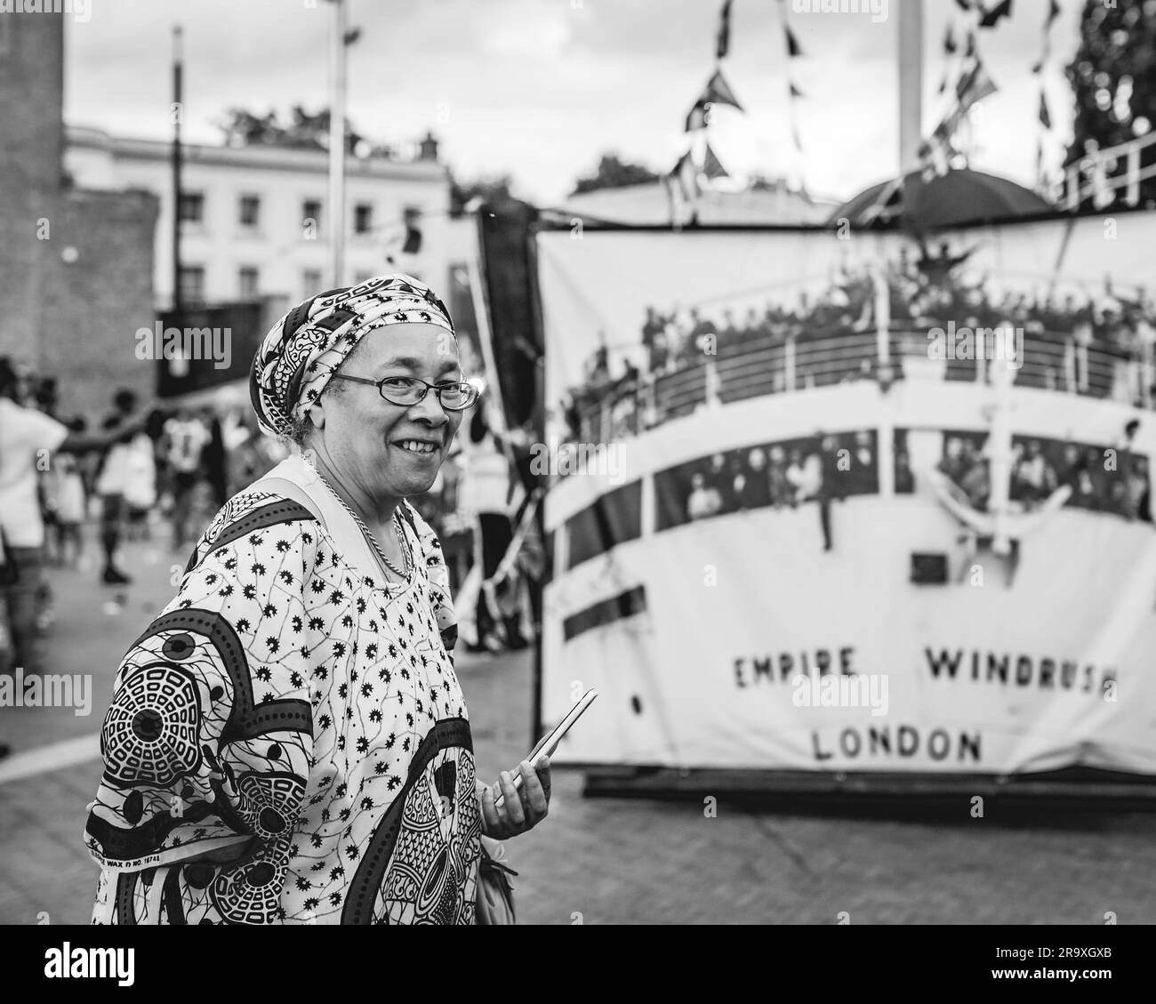A descendant of the Windrush generation poses by the Windrush float in ...