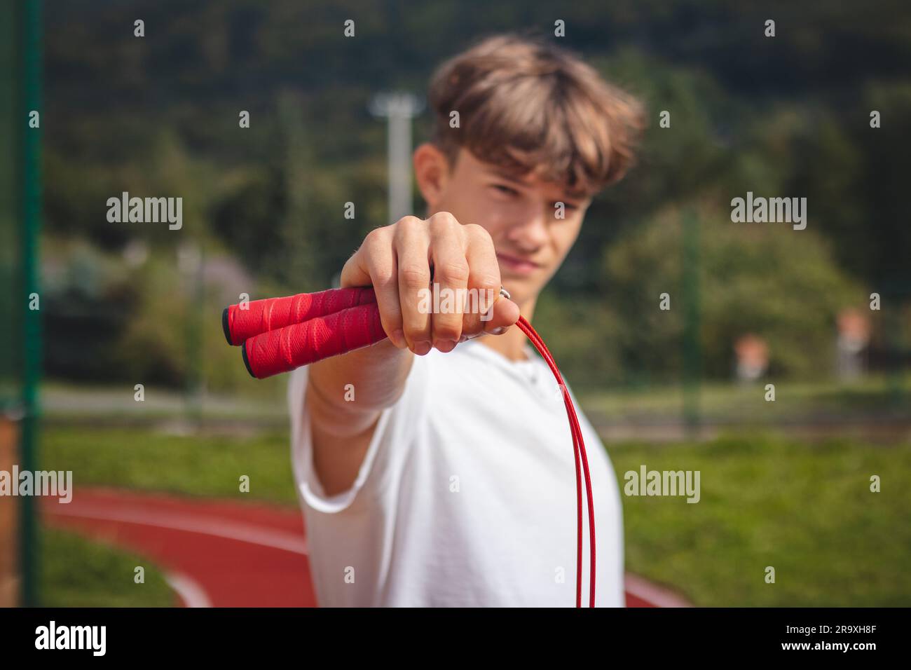 Brown-haired boy with an athletic build promotes the jump rope as one ...