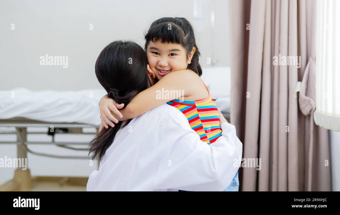 Doctor visiting little girl patient in medical examination room, Doctor ...