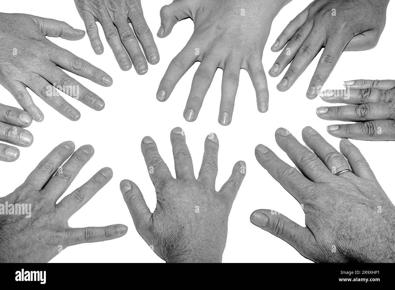 many hands on a table isolated on white Stock Photo - Alamy