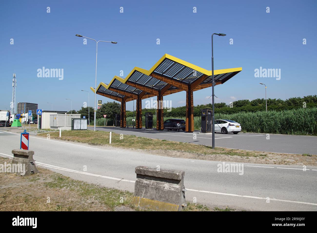 Fastned charging station, charge point with electric car on rest area ...