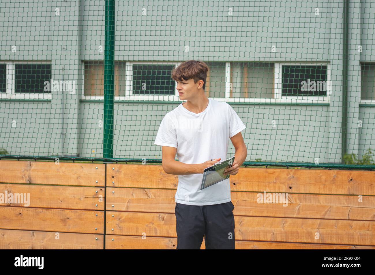 Young, ambitious coach instructs his players on what to do on the field ...