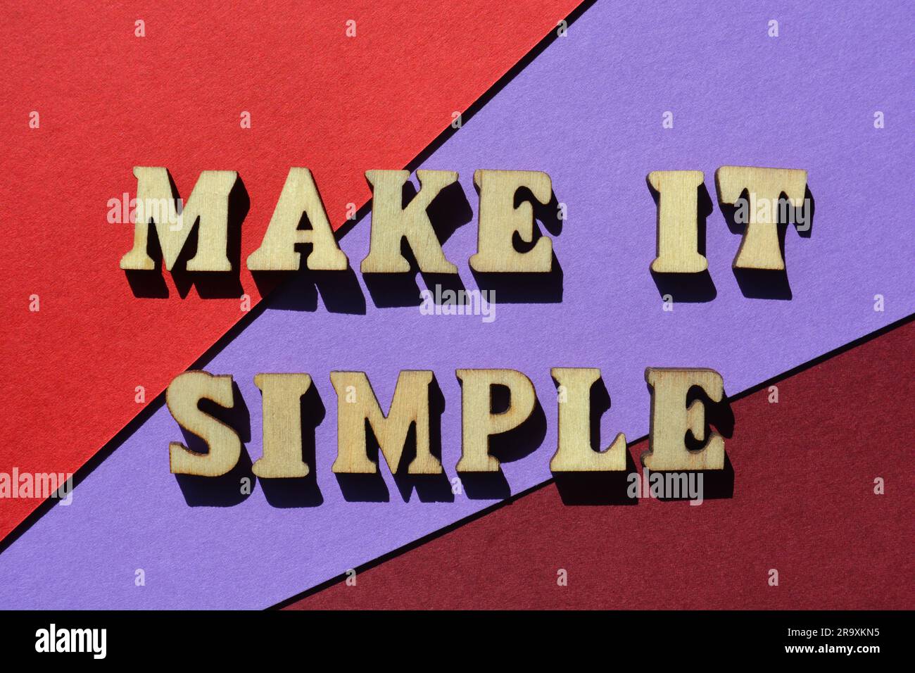 Make It Simple, words in wooden alphabet letters isolated on colourful ...