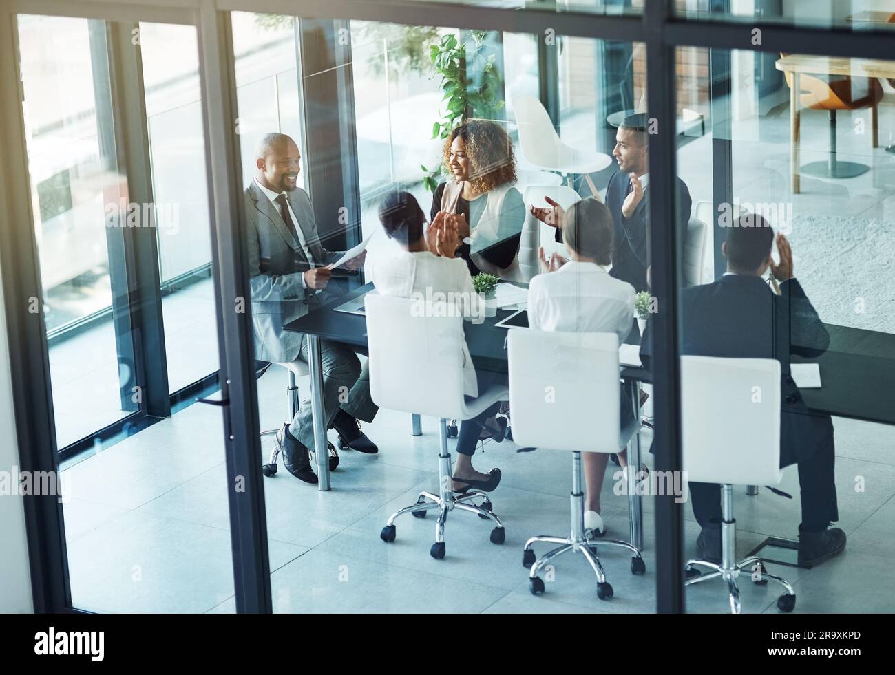 Meeting, applause and planning with business people in office for ...