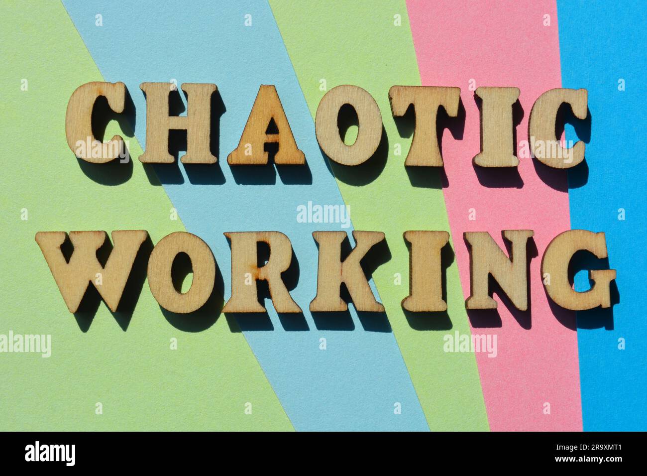 Chaotic Working, words in wooden alphabet letters isolated on ...