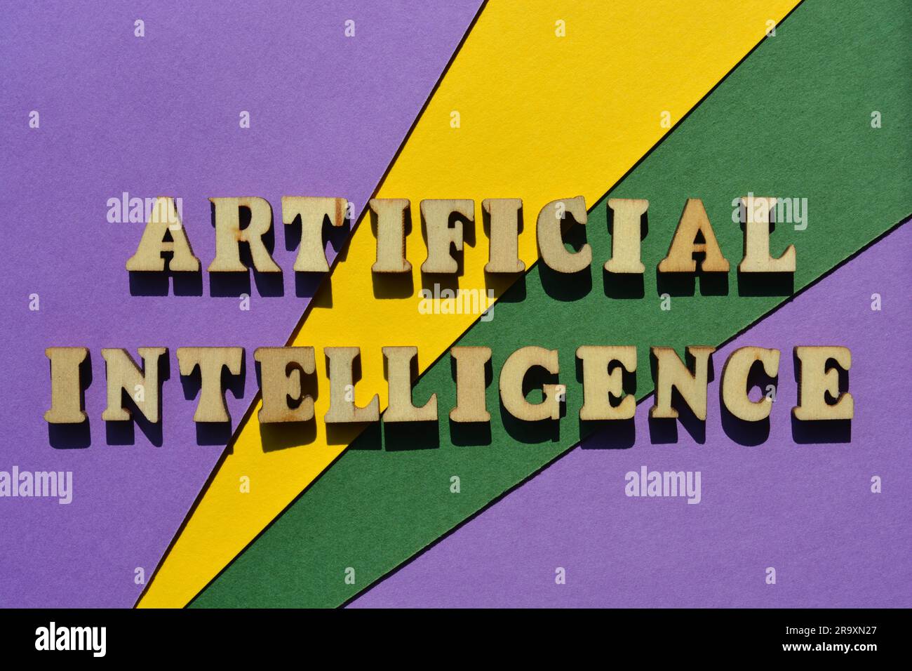 Artificial Intelligence, also known as AI, words in wooden alphabet ...