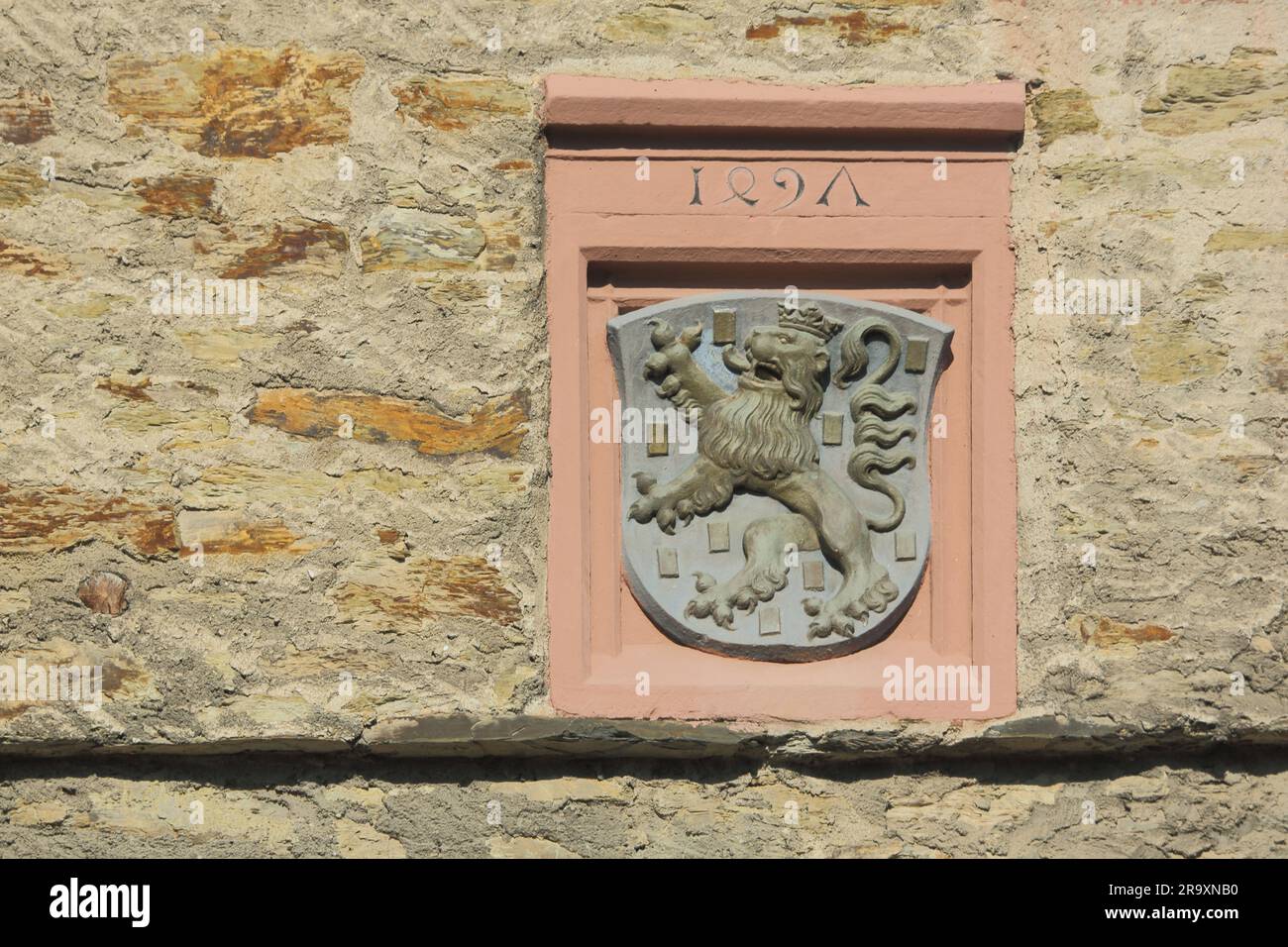 Coat of arms with a lion figure and the historical year 1497 above the ...