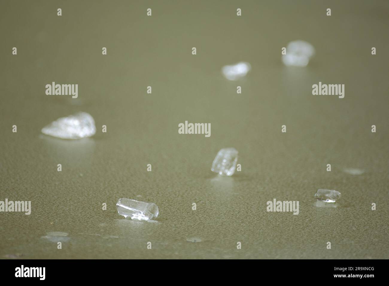 Transparent chunks of ice on frozen water surface Stock Photo - Alamy