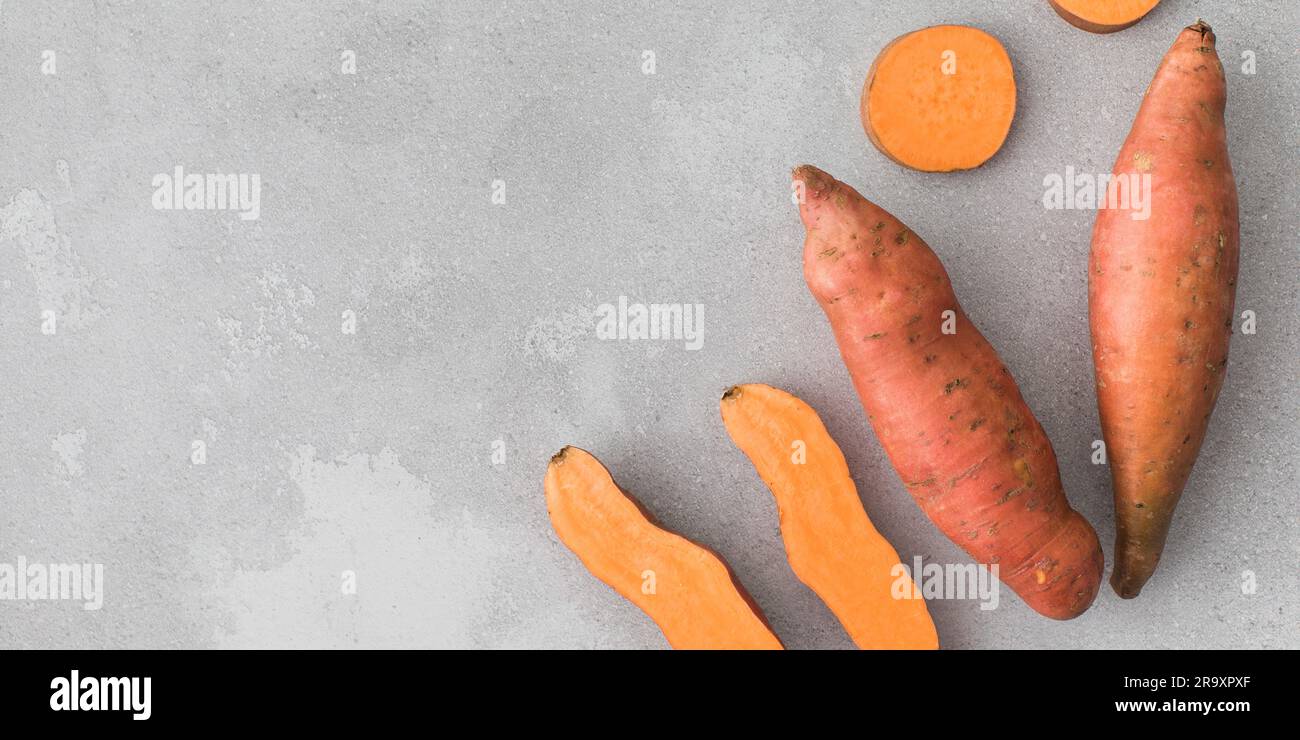 Raw sweet potatoes whole and cut. Orange kumara, sweet potato ...