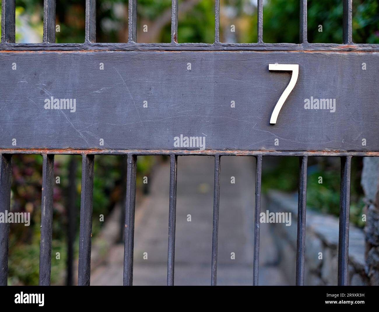 Numeral 7 / seven, shiny digit on a gate Stock Photo - Alamy
